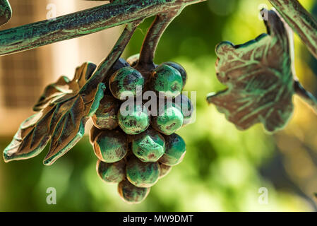 Forged metal bunch of grapes interior decoration Stock Photo - Alamy