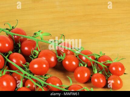 Group of traditional Italian tomatoes pachino on wooden background ...