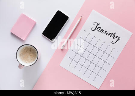 Flat lay with calendar, smartphone, cup of coffee, notebook and ...