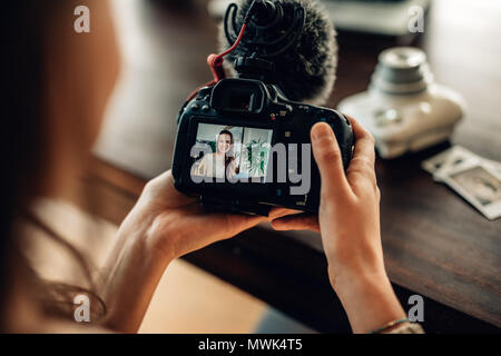 Close up camera screen, woman beauty blogger makes video review Stock ...