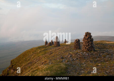 The 'Stone Men' on Wild Boar Fell at dawn, Cumbria, UK Stock Photo - Alamy