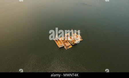 marine dredging digging sea bottom black mud in marina Stock Photo - Alamy