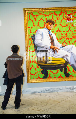 A painting of LL Cool J, center, by Kehinde Wiley, is seen in a gallery ...