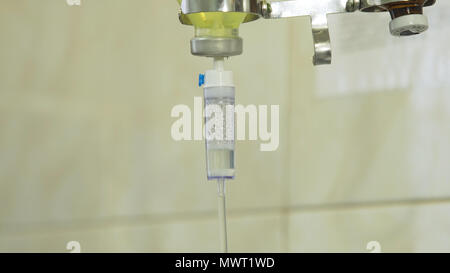 Infusion pump feeding IV drip in patient room in the hospital on ...
