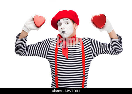 mime holding heart shaped gift box and pointing on camera isolated on ...