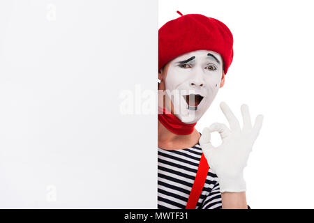 mime looking out from empty board isolated on white Stock Photo - Alamy