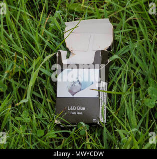 Discarded Cigarette packet on grass Stock Photo - Alamy