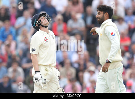 Pakistan's Shadab Khan, right, reacts after a shot played by England's ...