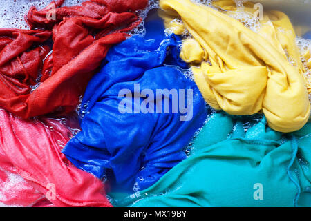 Soak a cloth before washing, Color clothes Stock Photo - Alamy