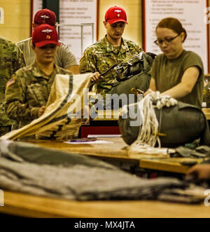 Parachute Riggers wear the Red Hat signifying that they are experts ...