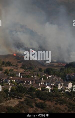 Aliso Viejo, California, USA. 2nd June, 2018. Helicopter drops water as ...