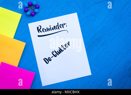 Reminder to De-Clutter still life motivational concept on clipboard and ...