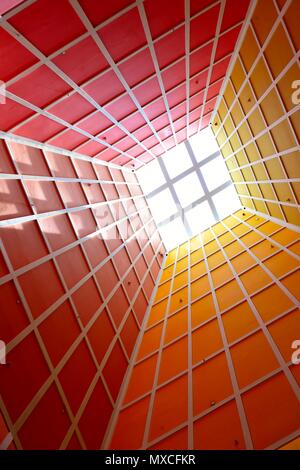Abstract perspective of vertical lobby ceiling with skylight and strong ...