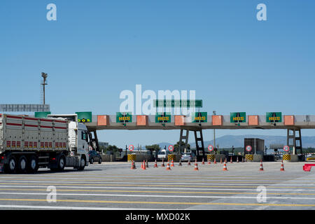 Cars passing through the toll gate on the motorway Stock Photo - Alamy