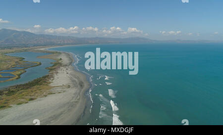 Aerial view of sandy beach Lingayen with azure water on the island ...