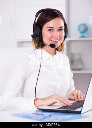 Young girl operating a laptop computer Stock Photo - Alamy