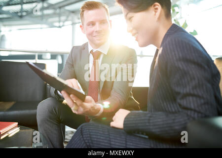 Sharing Creative Ideas with Coworker Stock Photo - Alamy