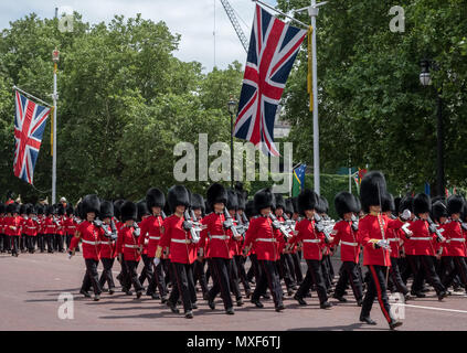 Soldiers with rifles marching down The Mall in London UK. Photo taken ...