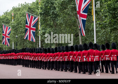 Soldiers with rifles marching down The Mall in London UK. Photo taken ...