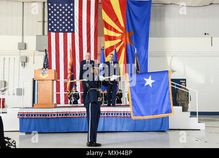 A member of the Honor Guard unfurls the general officer flag being ...