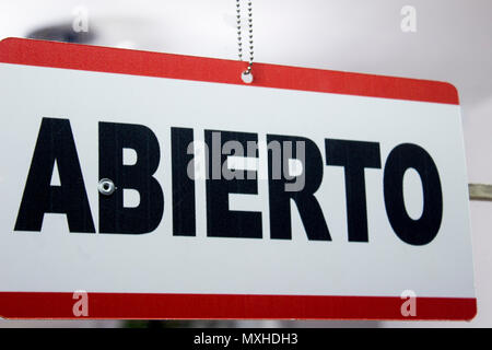 An spanish open sign hanging in a store. Abierto meaning open Stock ...