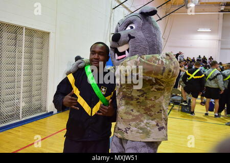Rocky, the 3rd Infantry Division mascot, poses with a statue of himself ...