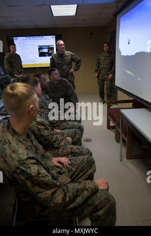 Major General James W. Lukeman looks down as his wife Francis Lukeman ...