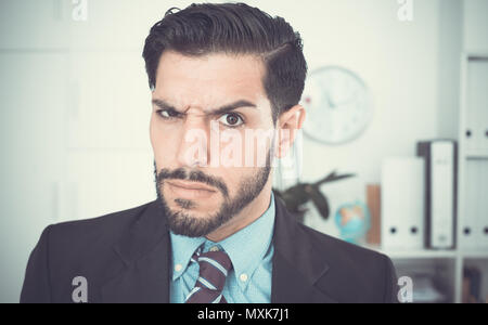 Portrait of indignant male who is working Stock Photo - Alamy