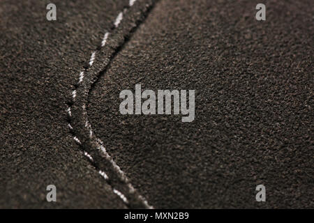 Black stitches on brown leather wallet macro close up view Stock Photo ...