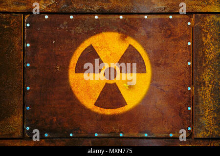 Round yellow radioactive (ionizing radiation) danger symbol painted on ...
