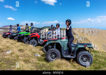 Friends driving off-road with quad bike or ATV and UTV vehicles Stock ...