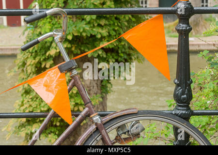 Orange flags (Dutch national color) and footballs against a clear Stock ...