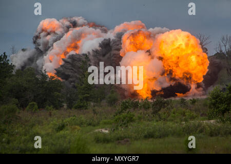 A mine clearing line charge (MCLIC) fired by U.S. Marine Corps M1 ...