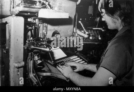 Typesetting machine operator at machine Stock Photo - Alamy