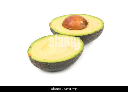 Fresh avocado huss is cut into two halves on a white background Stock ...