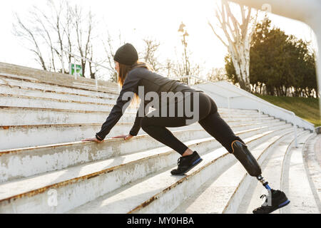 Image of disabled running girl with prosthetic leg in sportswear ...