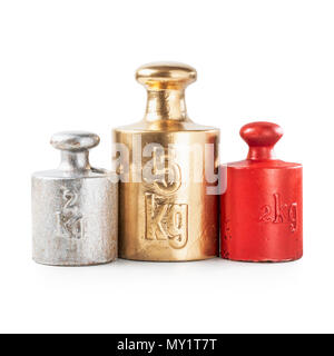 Old weights gold, silver and red colored collection isolated on white ...