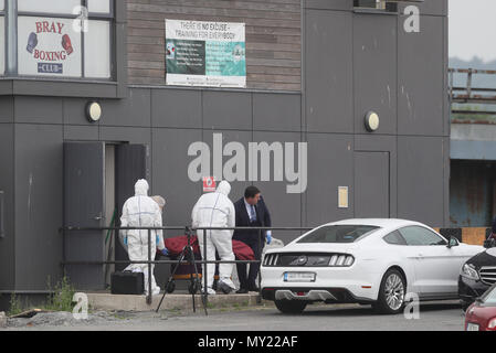 A body is removed from Bray Boxing Club, Bray, Co Wicklow, where three ...