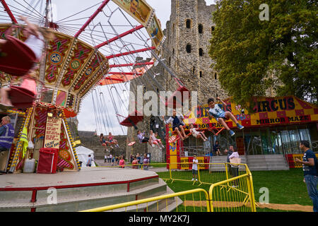 Fun rides at a fair or carnival at night Stock Photo - Alamy