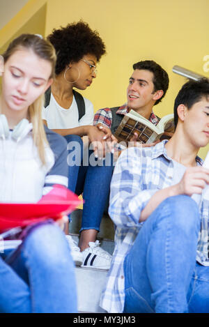 Group of Asian college student reading books and tutoring special class ...