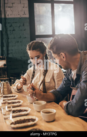 coffee shop workers checking coffee quality during coffee food function ...