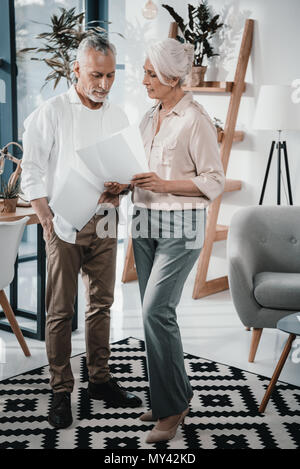 Senior business colleagues converse at office Stock Photo - Alamy