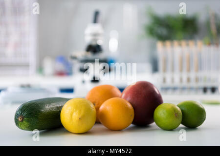 Scientific tools and fruits at workplace in modern biological ...