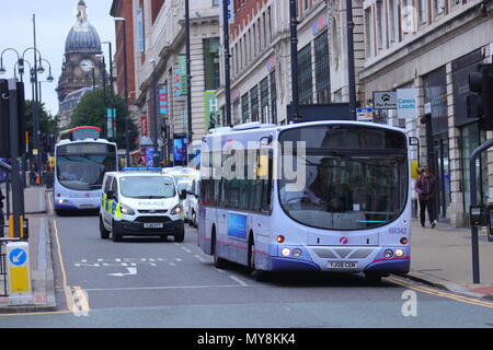 Buses heading down the Headrow in Leeds City Centre Stock Photo - Alamy