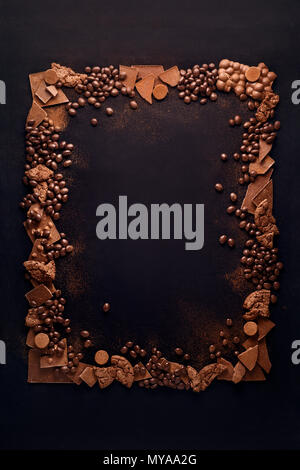 Creative concept photo of chocolate frame on black background Stock ...