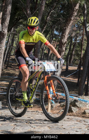 Greek cyclist warms up for an international mountain bike race in the ...