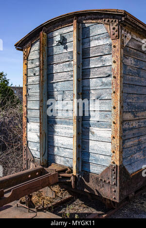 Vintage rusty car for the narrow-gauge railway isolated on white ...