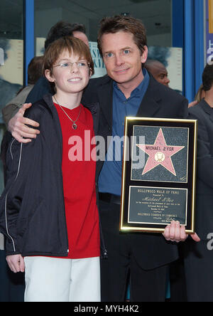 Michael J. Fox (posing with his son Sam ) received the 2209th Star on ...