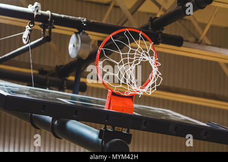a basketball backboard hoop and net retracted up for storage Stock ...