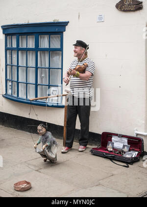 Fiddler and puppet Street entertainer in Whitby Stock Photo - Alamy